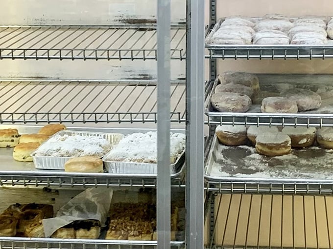 Empty shelves tell the sad tale of latecomers, while the remaining treats seem to whisper, "Next time, arrive earlier!"