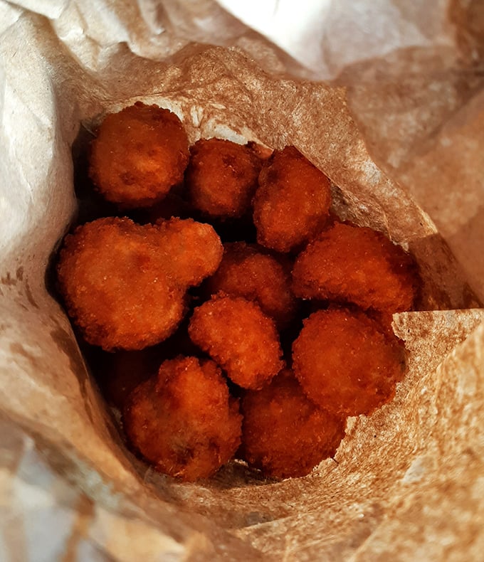 Golden mushroom nuggets that prove simple food done right is culinary poetry. Crispy outside, tender inside—the textural yin and yang of snack perfection.