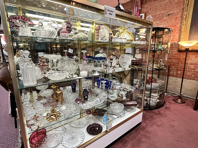 Crystal and cut glass catching light like diamond waterfalls. These pieces once graced tables where people celebrated without smartphones to distract them.