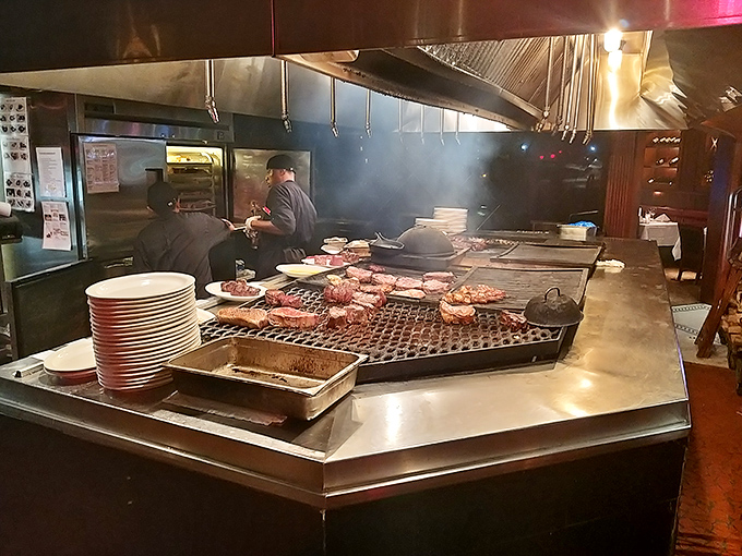 The open grill station lets you watch the magic happen as steaks sizzle over that famous wood-burning pit.