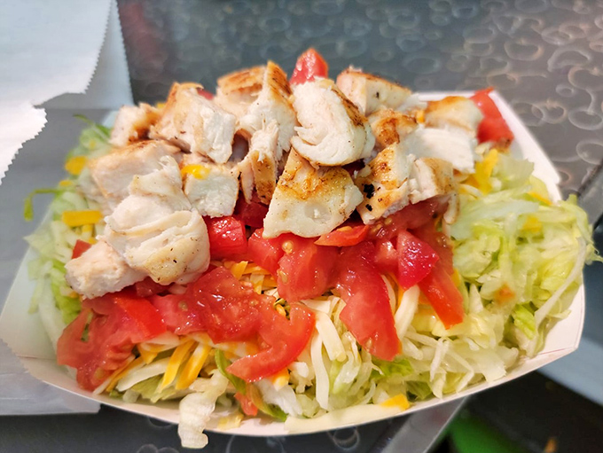 Not all heroes wear capes&mdash;some come in paper boats. This grilled chicken salad offers a moment of virtuous eating before you inevitably order dessert.