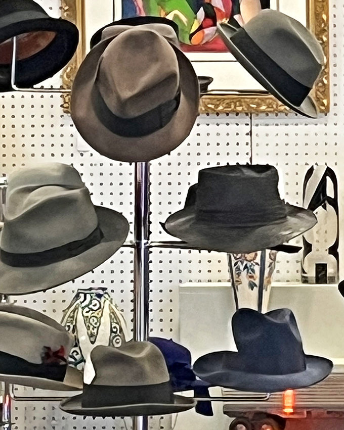 Fedoras and felt hats stand at attention, ready to transform ordinary heads into extraordinary fashion statements.