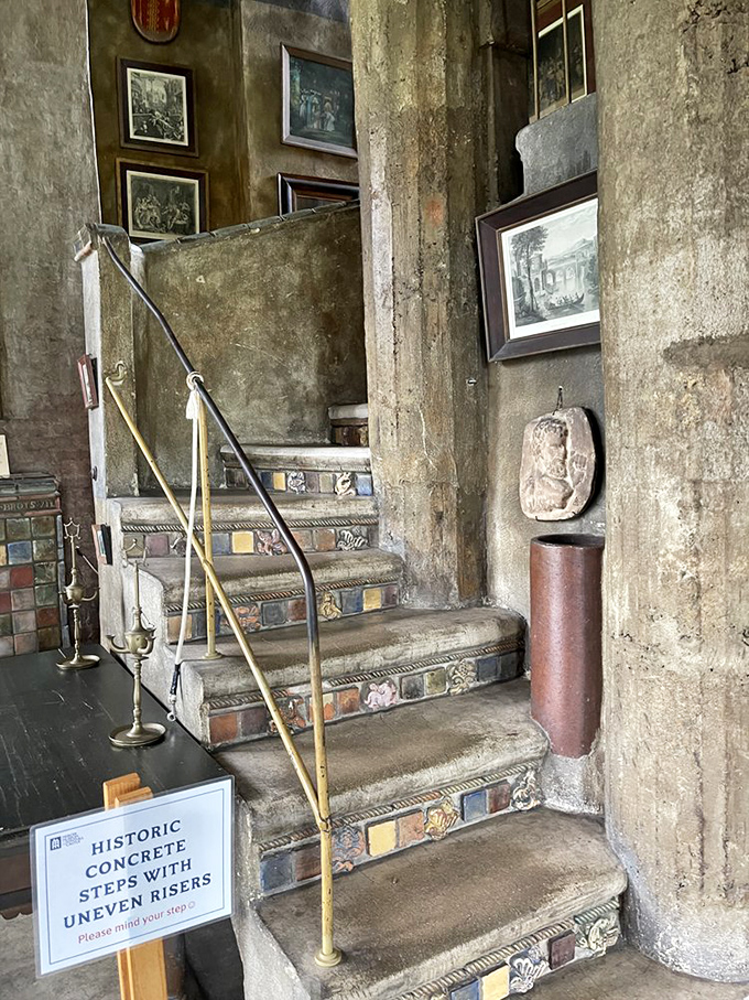 These tile-embedded stairs warn visitors to "mind your step"&mdash;solid advice when navigating a house built on whimsy rather than blueprints.