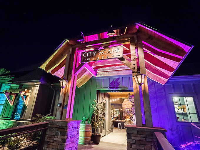 The entrance after dark looks like what would happen if a traditional barn and a nightclub had an architecturally stunning baby.