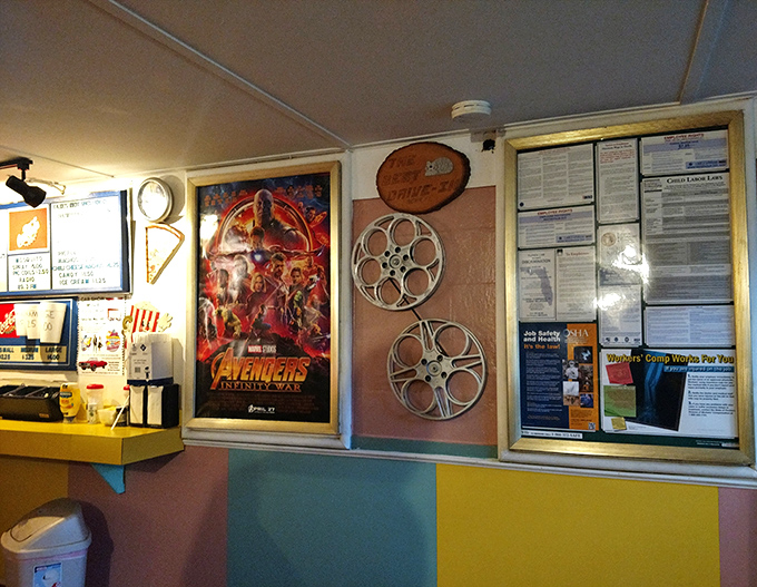 Inside the snack bar, movie memorabilia and vintage film reels create a mini-museum of cinema history between the popcorn machine and candy counter.