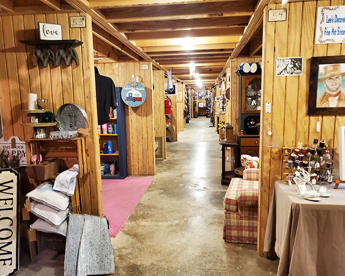 Wood-paneled corridors create a warm, cabin-like atmosphere where each vendor's space feels like peeking into someone's carefully curated living room from decades past.