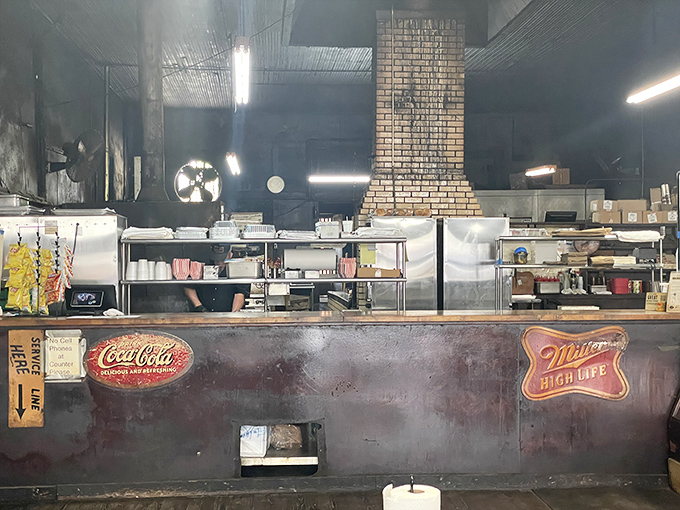 Behind that worn counter, the magic happens: smoke, fire, time, and skill converging into something genuinely extraordinary.