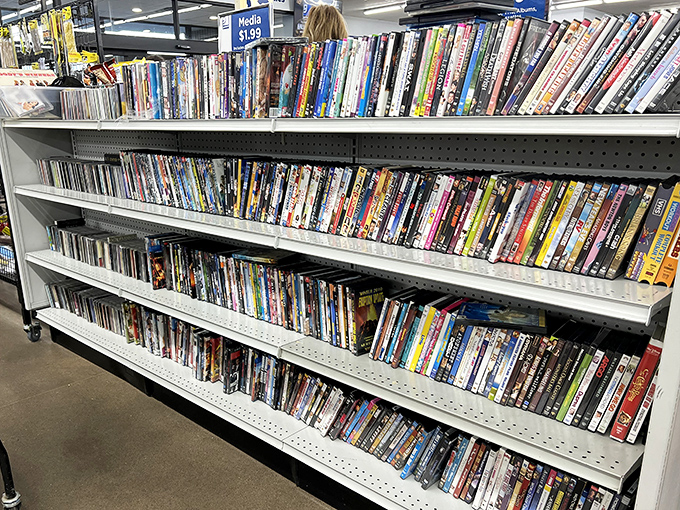 The media section: a nostalgic time capsule where DVDs of forgotten rom-coms sit alongside the complete series of shows you swore you'd watch someday.