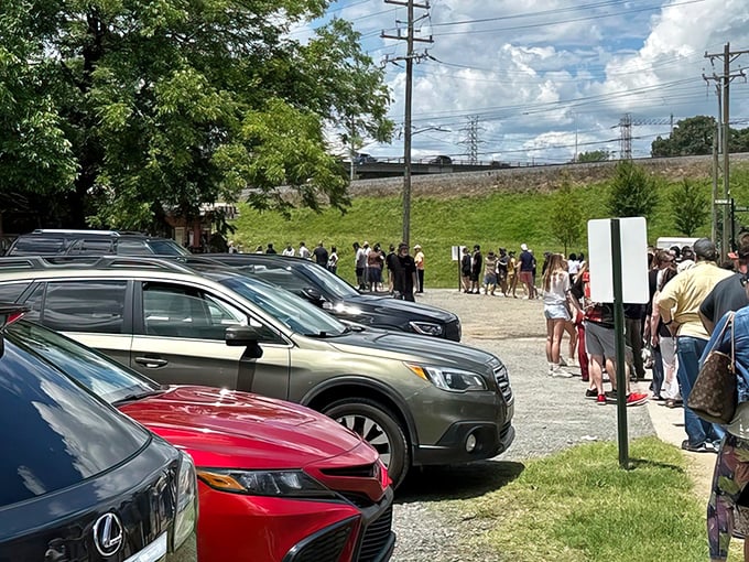 Pilgrimage in progress: Devotees line up outside Brooks, their cars filling the lot. The burger faithful know that greatness requires patience – and in Charlotte, this wait is absolutely sacred.