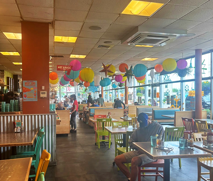 Colorful lanterns float overhead like breakfast thought bubbles, adding whimsy to a space already buzzing with satisfied customers.