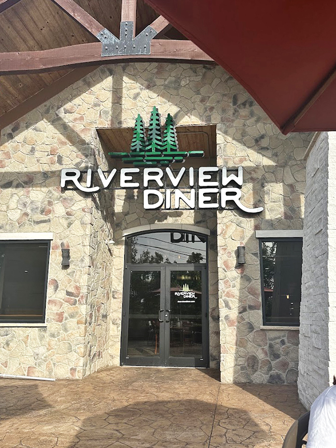 The Riverview sign promises exactly what awaits inside: a dining experience that flows as smoothly as the nearby river.