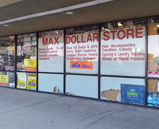 The window display advertises everything from phone cards to picture frames &ndash; one-stop shopping at its finest.