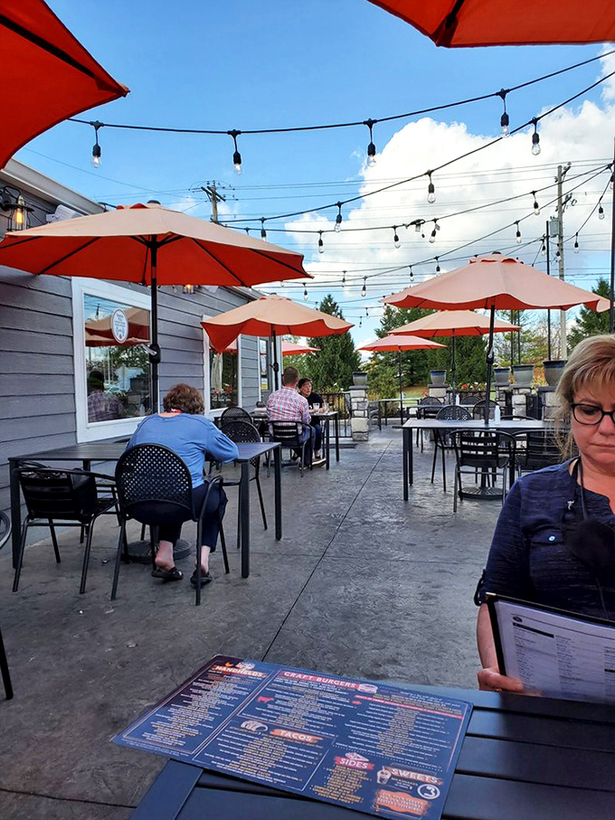The patio: where fresh air and fresh food create summer magic. String lights overhead turn ordinary Tuesday dinners into special occasions.