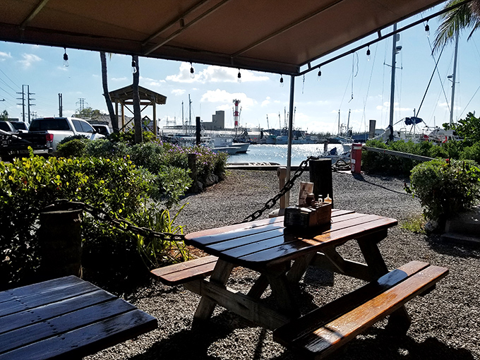 Outdoor seating with a view that no interior designer could replicate. The working marina provides dinner and a show, Keys-style.
