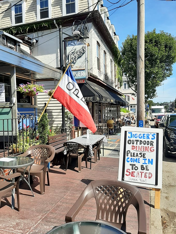Outdoor seating with Rhode Island pride flying high. The perfect spot to enjoy your breakfast while watching East Greenwich wake up.