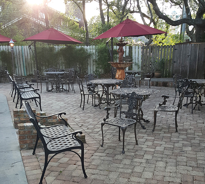 The outdoor patio at golden hour&mdash;where the umbrella-shaded tables and brick pavers create the perfect stage for your seafood feast.