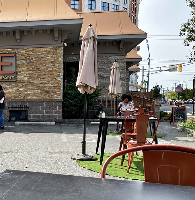 Outdoor seating that turns sidewalk dining into an urban oasis. Those copper chairs aren't just stylish&mdash;they're thrones for pancake royalty enjoying the Jersey City air.