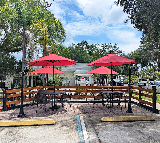 The outdoor seating area offers Florida sunshine with your seafood feast. Those red umbrellas are practically saying "sit here, stay awhile."
