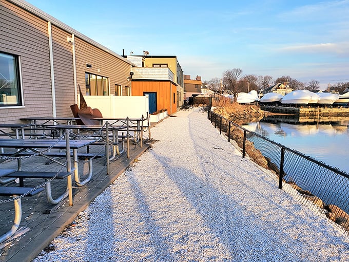 The outdoor seating area offers a snow-dusted path alongside the water&mdash;proving New Englanders don't let a little winter interfere with waterfront dining.