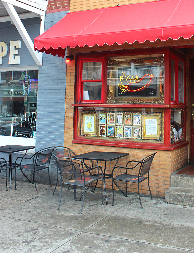 The red-trimmed facade and outdoor seating create the perfect prelude to the flavor symphony waiting inside. Hot dog diplomacy at its finest.