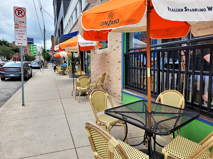 Sidewalk seating under bright Cinzano umbrellas brings a touch of Roman holiday to Pennsylvania's urban landscape.