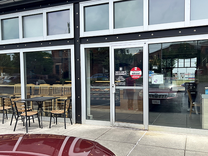 The outdoor seating area beckons like an oasis, promising a moment of peace in a chaotic world—with doughnuts as your meditation focus.