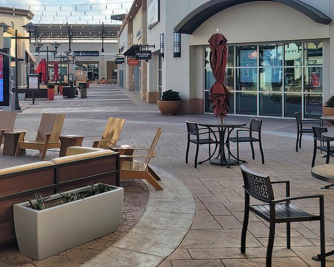 Thoughtfully designed outdoor spaces invite shoppers to rest weary feet and contemplate their next retail conquest. Strategic seating for tactical shopping breaks.