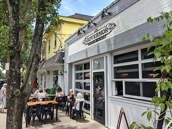 Sidewalk dining where people-watching is as satisfying as the menu. These patrons know the secret to happiness is good food in fresh air.