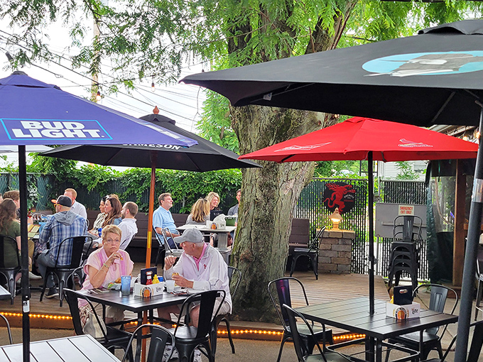 The cheerful patio with colorful umbrellas &ndash; where summer memories are made between bites of impossibly large sandwiches.