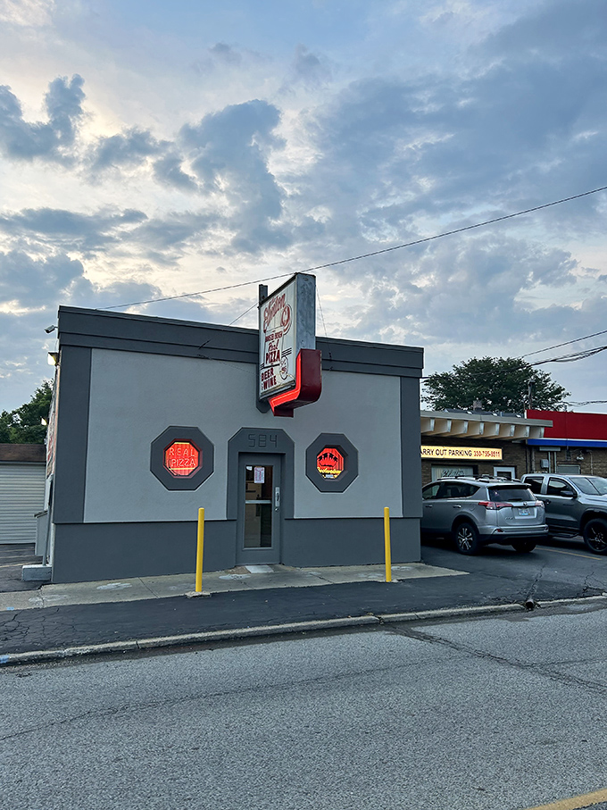 The gray building with its vintage signage stands as a beacon of consistency in a world of constant culinary trends.