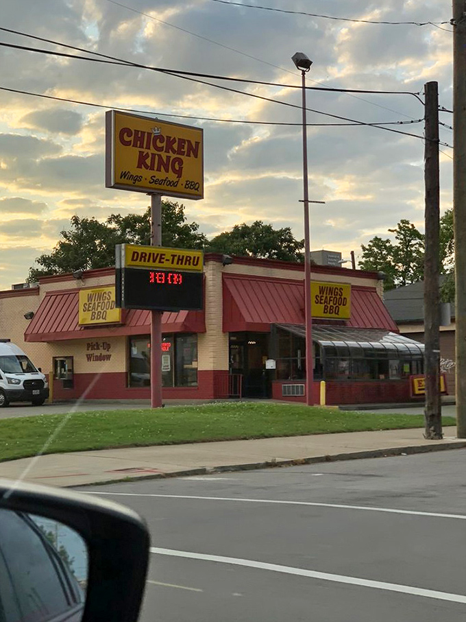 That sunset behind the Chicken King sign looks nice, but the real golden hour happens inside those fryers.