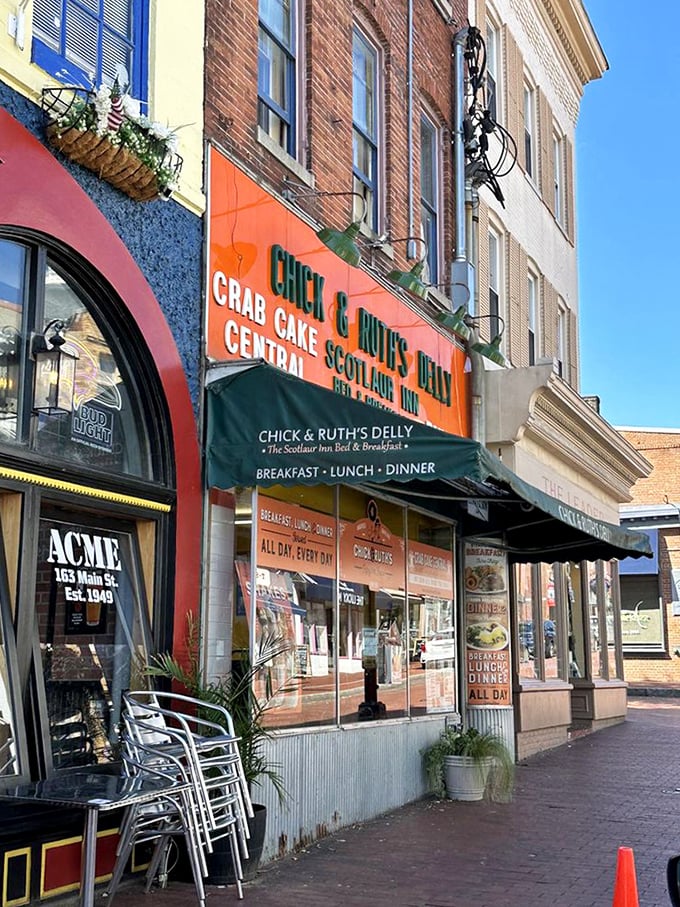 From the brick sidewalk of Main Street, that orange sign calls to you like an old friend saying, "Yes, you definitely need a sandwich right now."