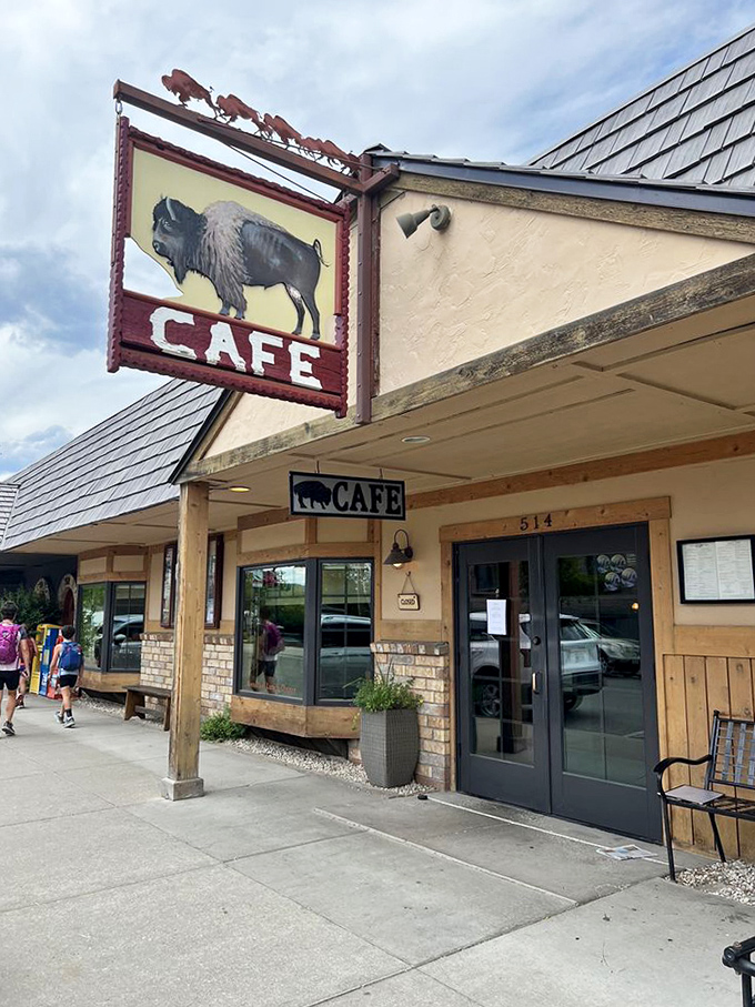 A buffalo statue standing guard by the window &ndash; the unofficial greeter and most photographed non-edible item in the caf&eacute;.