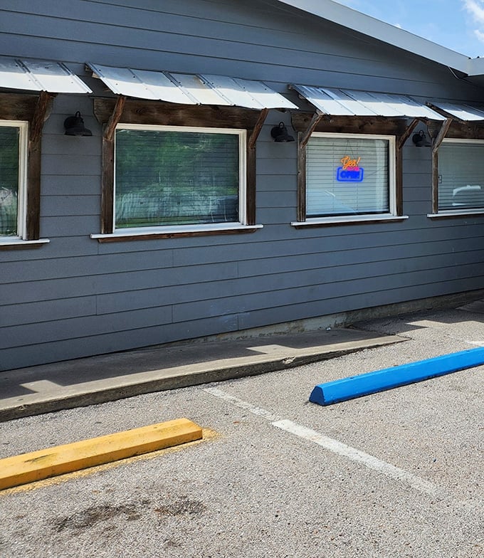 Simple gray siding and parking bumpers&mdash;no valet needed when you're about to experience food worth driving miles for.