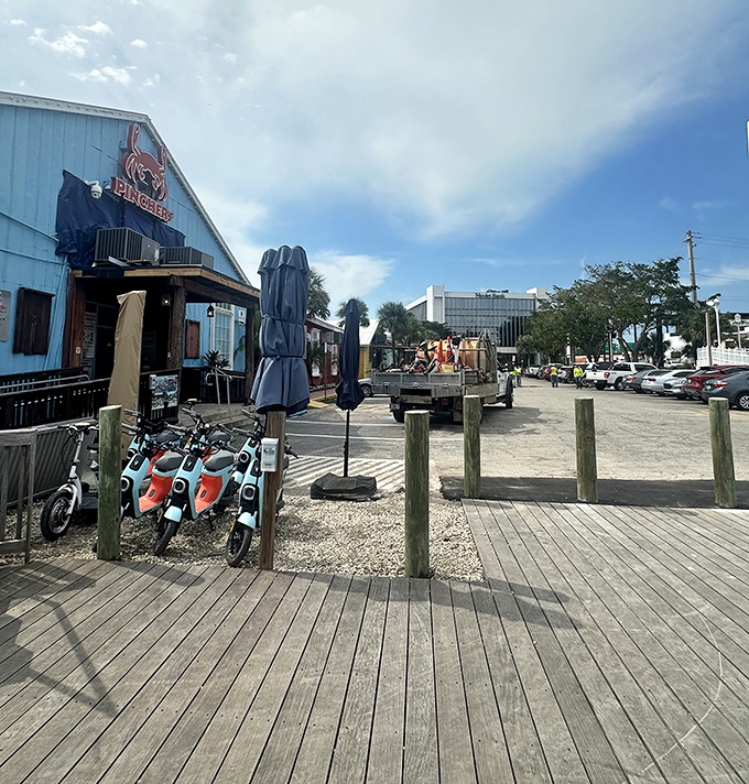 Arrive by land or sea&mdash;Pinchers' casual outdoor setup with colorful scooters parked outside says "leave your pretensions at home, bring your appetite instead."