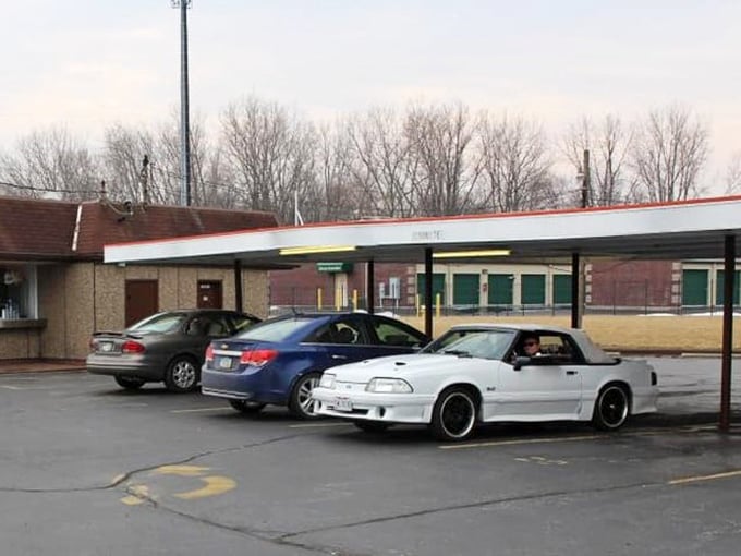 The parking area tells the real story&mdash;cars from all walks of life gathered in democratic appreciation of good, honest food.