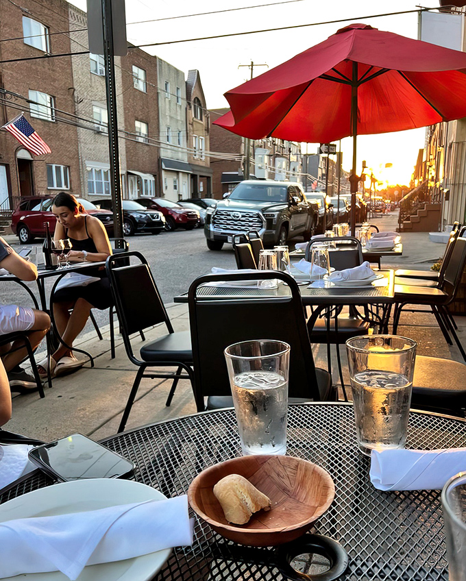 Sunset dining on the sidewalk patio adds a touch of urban romance to your meal. The bread basket is just the opening act of this culinary performance.