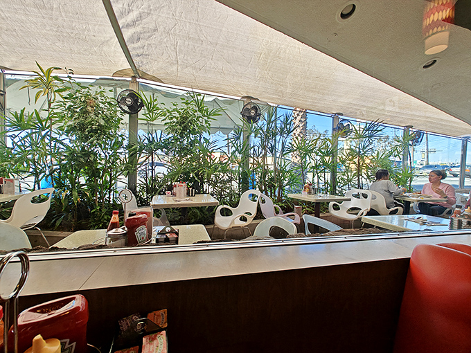 The dining room's wall of windows floods the space with that famous California light, turning an ordinary breakfast into a sun-dappled event.