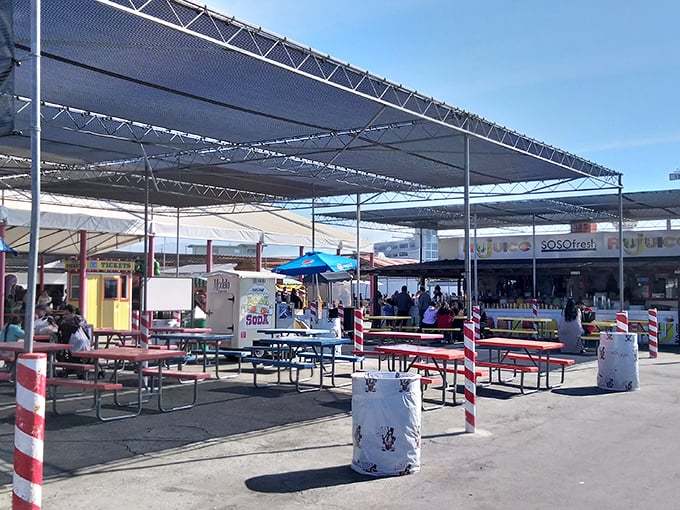 The food court oasis where tired shoppers refuel. Those red benches have witnessed countless bargaining victories and shopping strategy sessions.