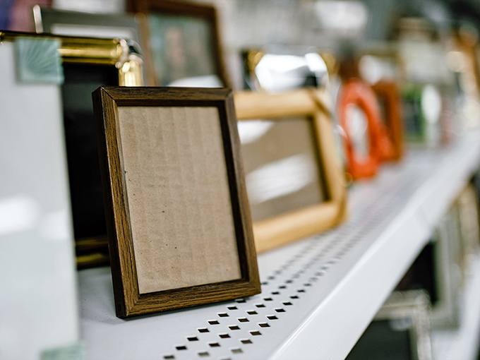 Empty frames await new memories and artwork, their wooden borders ready to transform blank walls across Mississippi.
