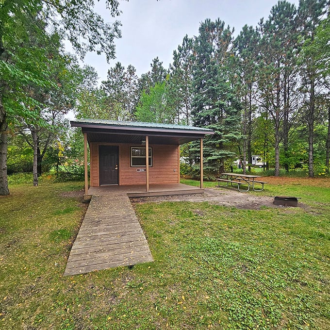The modern cabin offers wilderness comfort without the wilderness discomfort. Like camping, but with actual walls and a real bed.