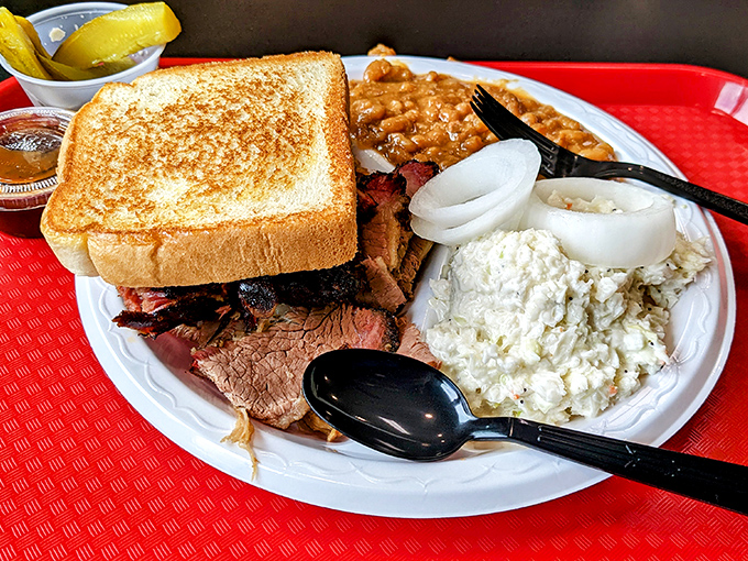 A barbecue platter that's basically a family reunion of flavors. The toast is just there to soak up any sauce you might accidentally leave behind.