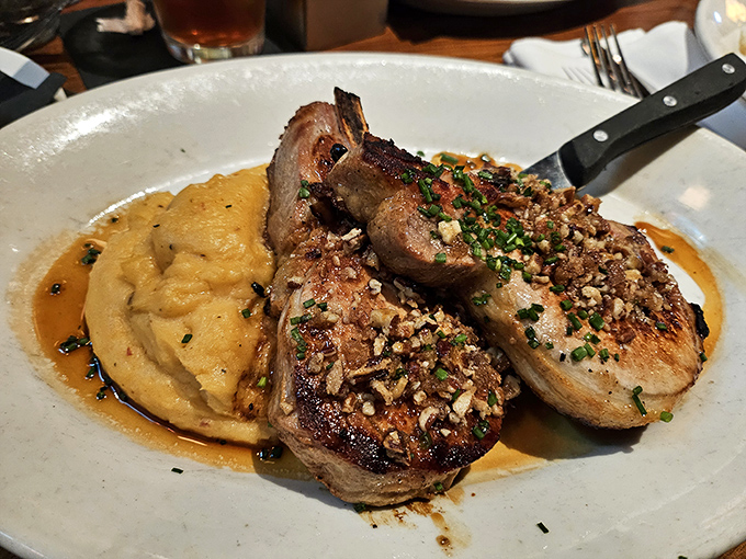 Pork chops that make you want to write poetry, served with mashed potatoes so smooth they could talk their way out of a speeding ticket.