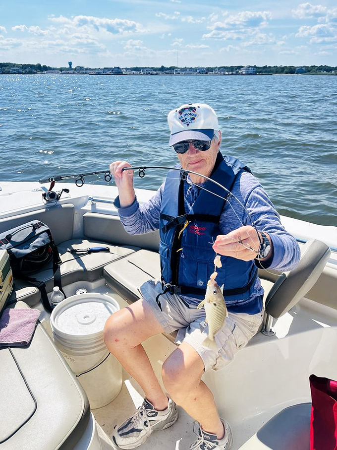 "The one that didn't get away!" A proud angler displays the day's catch, proving Barnegat Bay's reputation as a fisher's paradise.