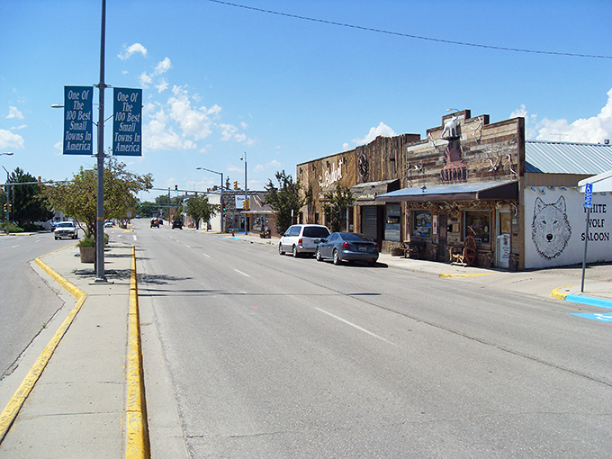 Downtown storefronts maintain their frontier character, where the White Wolf Saloon promises refreshments rather than "artisanal beverage experiences."