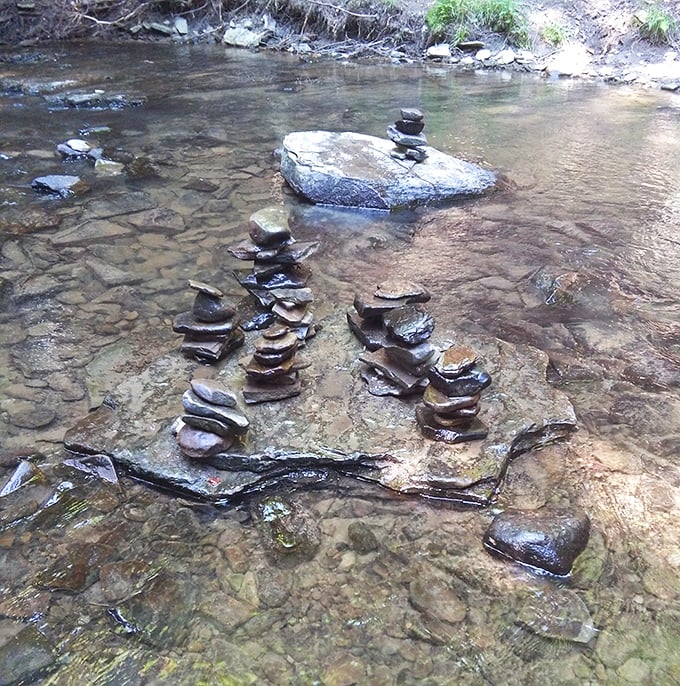 Stone stacking &ndash; the original wilderness meditation practice. These carefully balanced cairns represent moments of perfect focus amid nature's flowing waters.