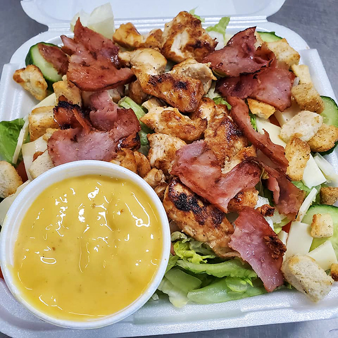 This isn't just a salad &ndash; it's a protein party with greens invited as guests. That golden dressing is practically winking at you.