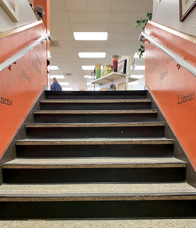 The stairway to second-floor savings beckons shoppers upward, promising even more departments of pre-loved possibilities.