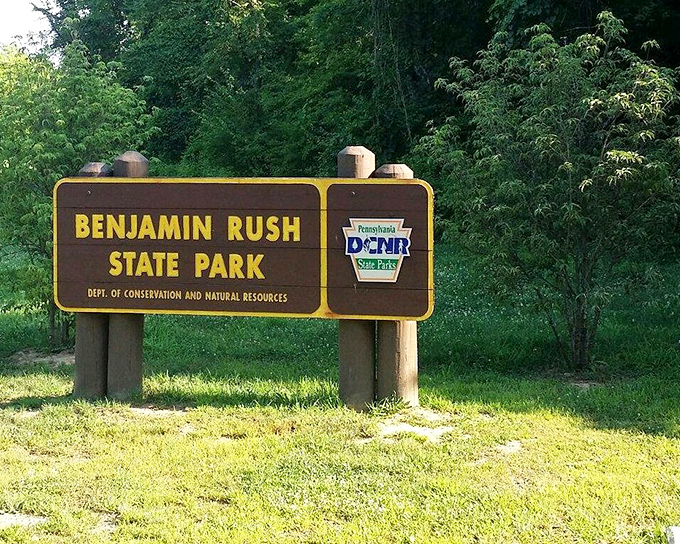 Another view of the park's welcoming sign, standing like a promise of the natural treasures that await just beyond the entrance.