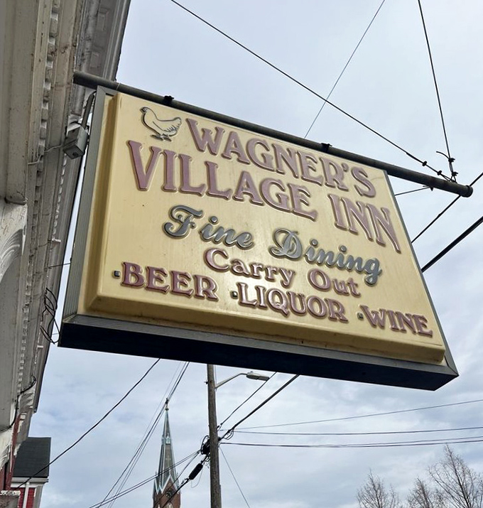 Even the sign knows what matters: Fine Dining, Carry Out, and adult beverages to wash down that legendary chicken.